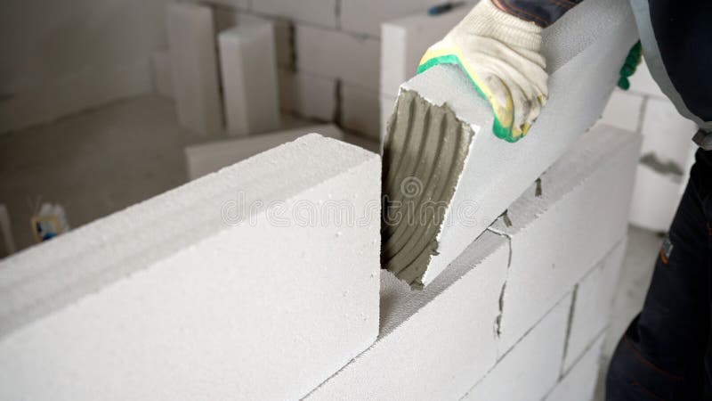 Construction Site of a House Made of Light Bricks. the Master Builds a ...