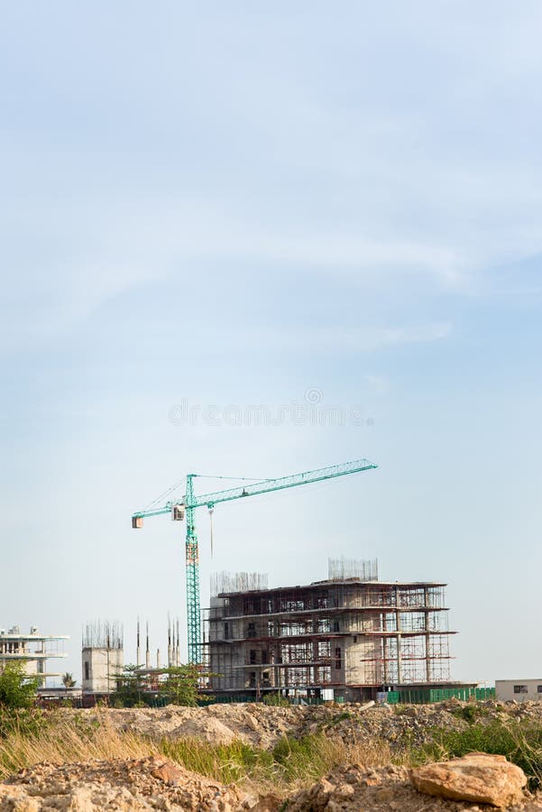 Construction Site Including Several Cranes Working on a Building ...