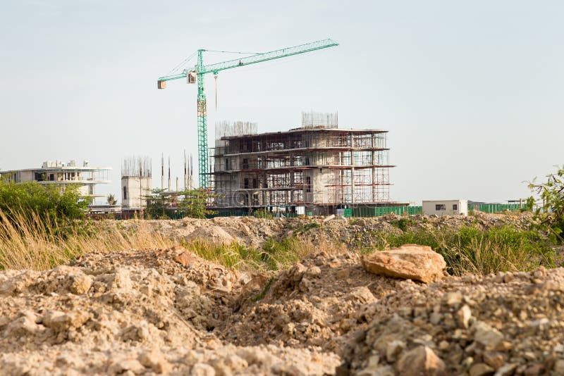 Construction Site Including Several Cranes Working on a Building ...