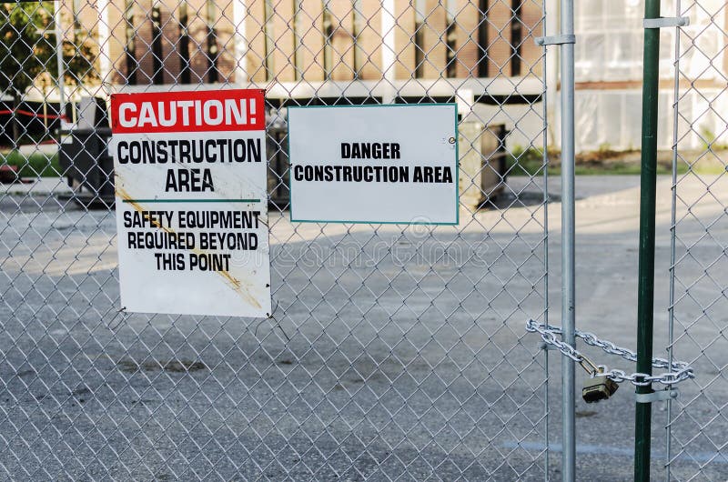 Construction Site with Locked Gate and Caution Sign Stock Photo - Image ...