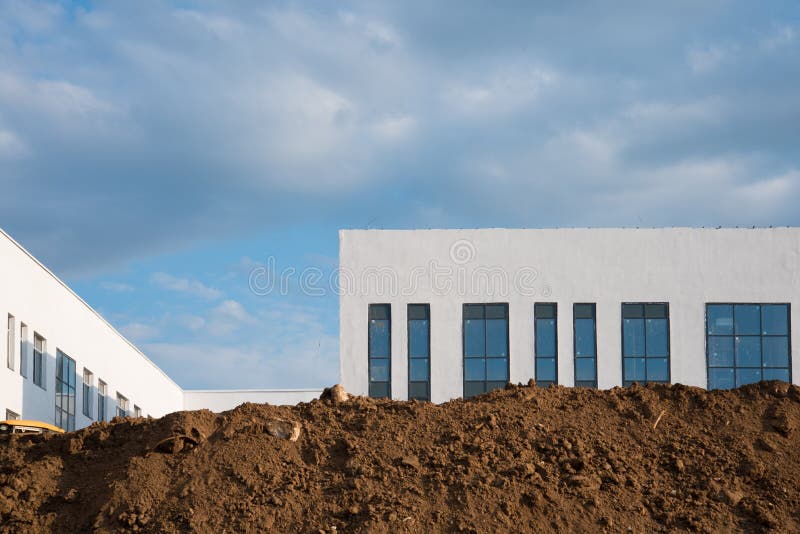 Construction Site. Lots of Dirt and a New White Building Stock Image ...