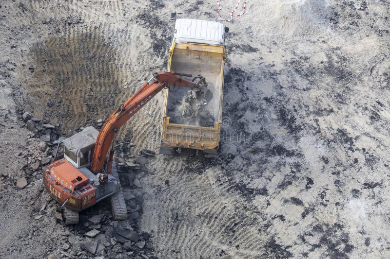 At the Construction Site, Machinery is Transporting Mud. Editorial ...