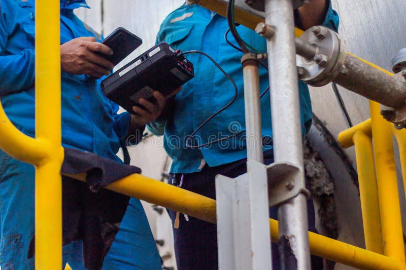 Maintenance Professionals Performing Industrial Inspection Holding ...