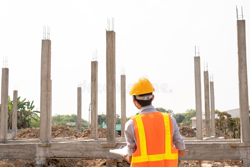 The Construction Site Male Engineer or Architect is Exploring and ...