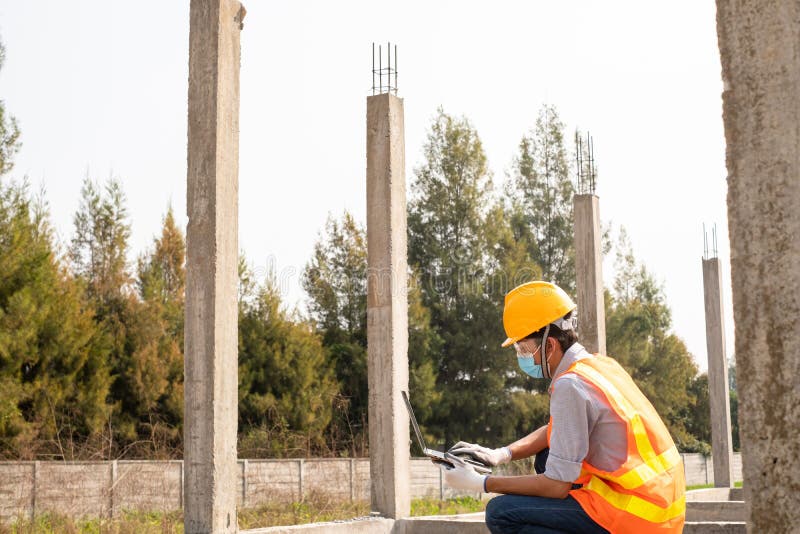 The Construction Site Male Engineer or Architect is Exploring and ...