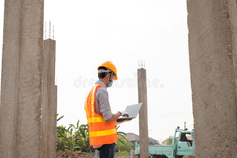 The Construction Site Male Engineer or Architect is Exploring and ...