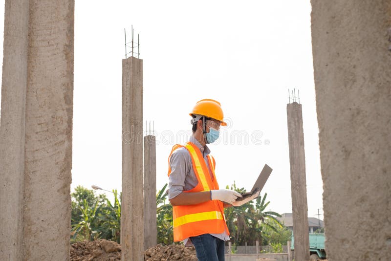 The Construction Site Male Engineer or Architect is Exploring and ...