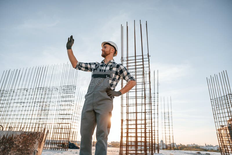 On Construction Site. Man in Grey Uniform is Working Stock Image ...