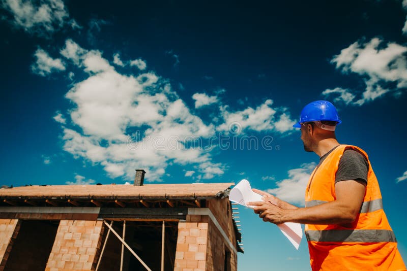 Construction, Site Manager Overseeing Construction of the New Building ...