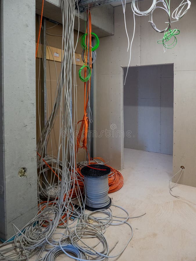 On Construction Site Many Network and Power Cables Hang from the ...