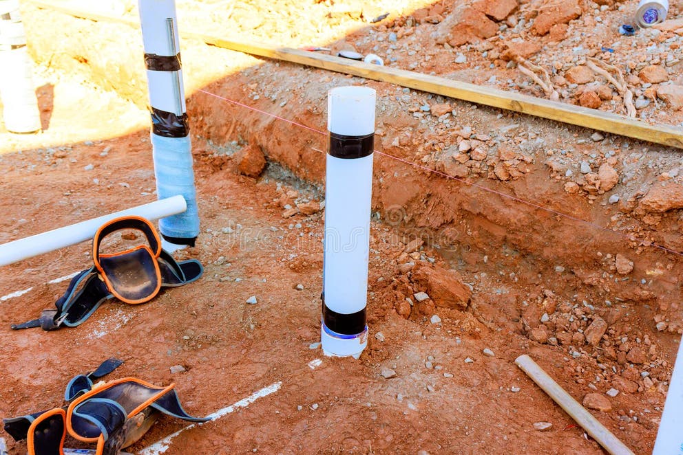 Construction Site with Marked Foundations and Tools for Building Preparation in Bright Daylight ...