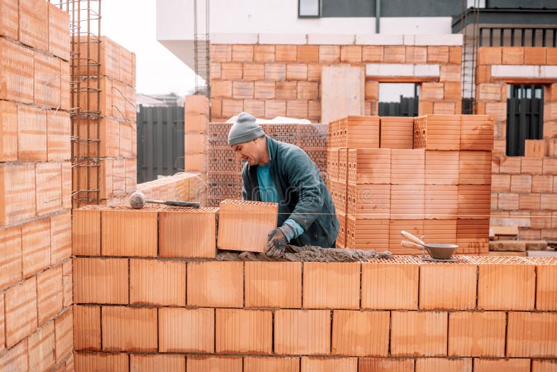 Construction Site and Mason Bricklayer Working with Bricks Stock Image ...