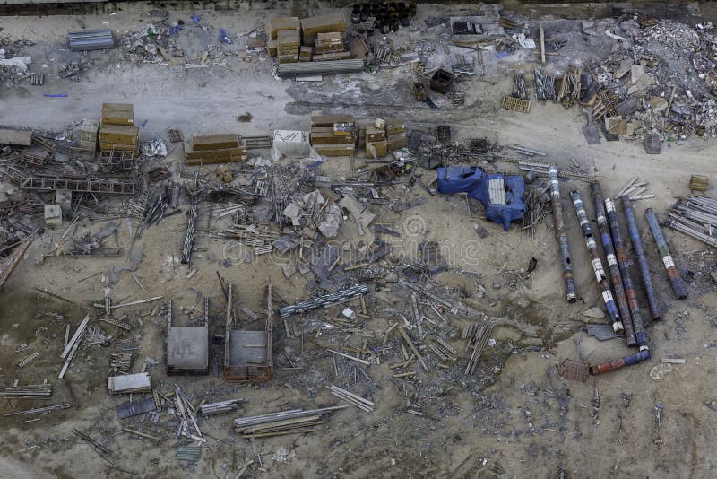 A Mess At A Construction Site With Scattered Building Materials And ...