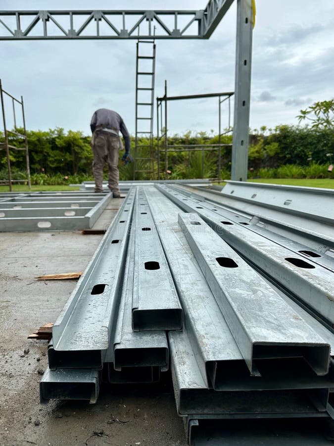 Construction Site with Metal Beams and Worker Stock Photo - Image of ...