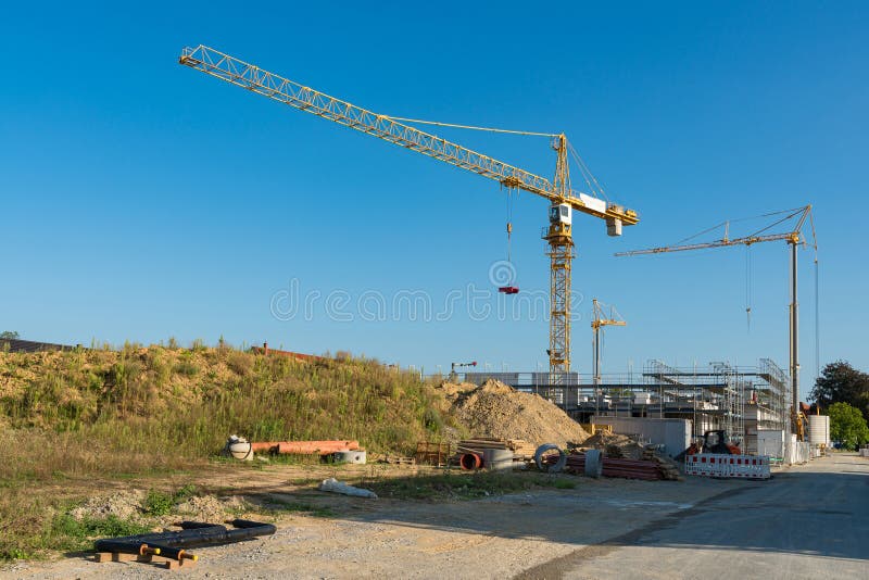 Construction Site with Multiple Tower Cranes and Building Materials ...