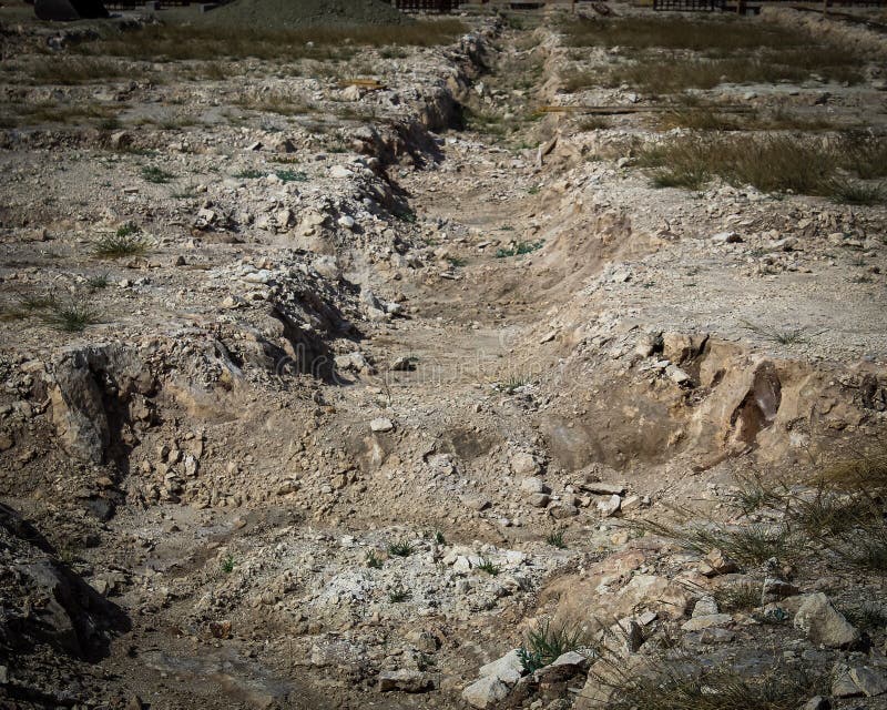 Trench Dug in Rocky Terrain. Construction Site Background Texture. Low ...
