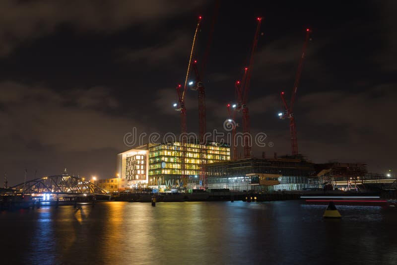 Construction site at night editorial photography. Image of crane ...