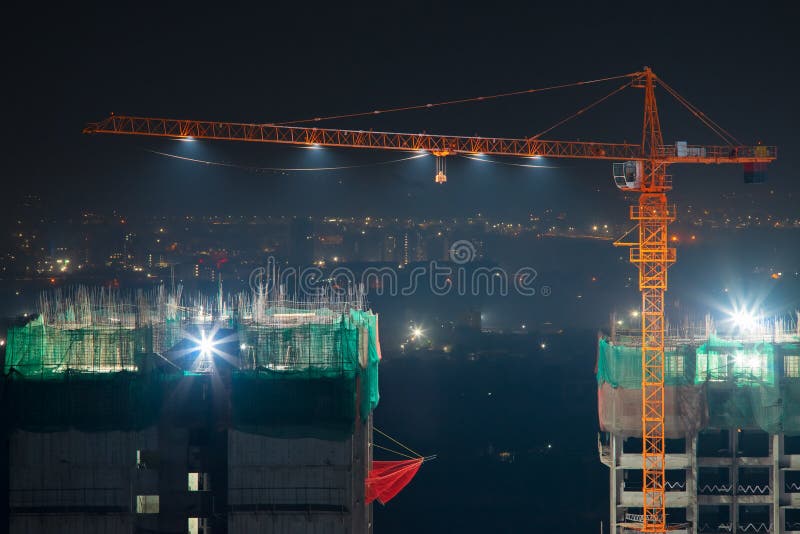Construction site at night stock photo. Image of high - 215098894