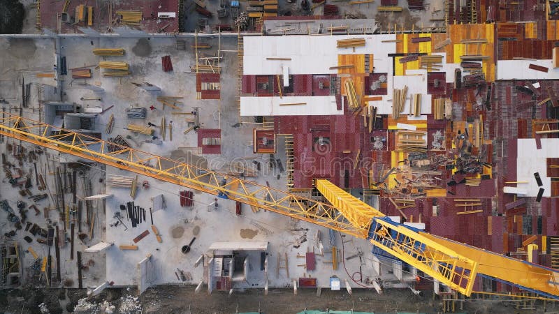 Construction Site Overview Showing Materials and Crane during Daytime ...