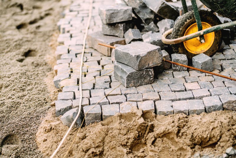 Construction Site - Pavement Road Building with Cobblestone Blocks ...