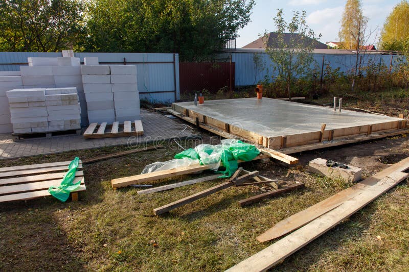 A Construction Site with a Pile of Wood and a Pile of Bricks Stock ...