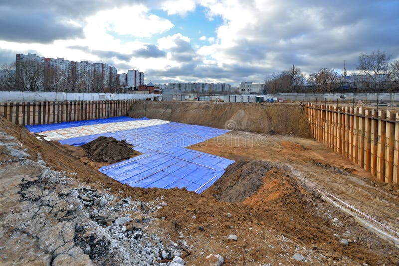 Construction Site; Construction Pit with Metal Pipes Supporting Stock ...