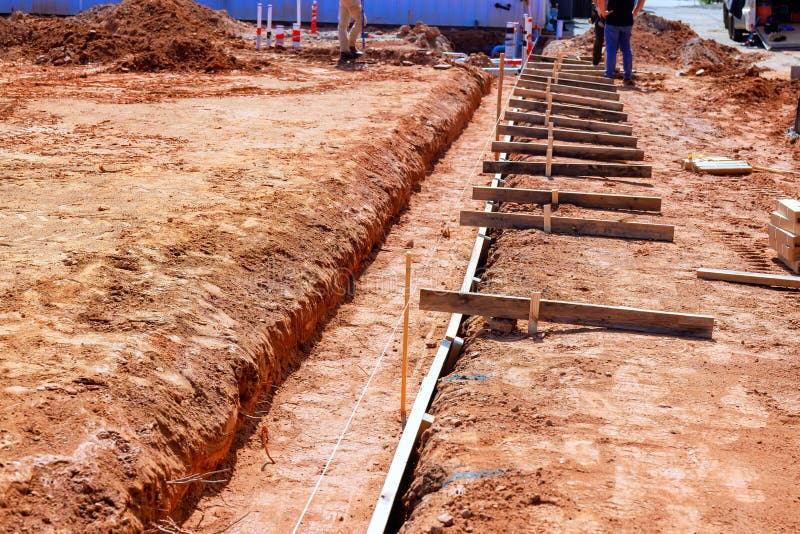 Construction Site Preparation for Foundations with Trenches and Wooden ...