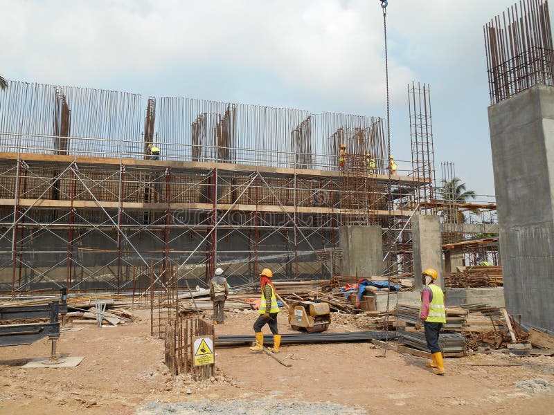 Messy and Busy Construction Site. Commencing with Ground and Foundation ...