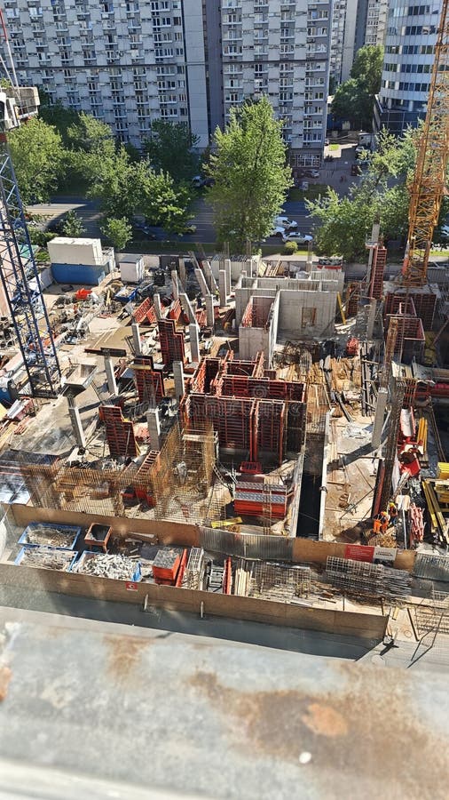 Construction Site with Reinforced Concrete Structures, Cranes, and ...