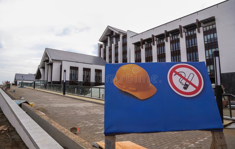 Construction Site Safety Sign Near a Modern Building Under Development ...
