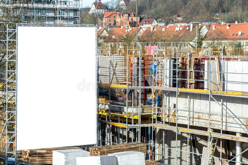 Construction Site with Scaffolding and Large Blank Poster Stock Photo ...