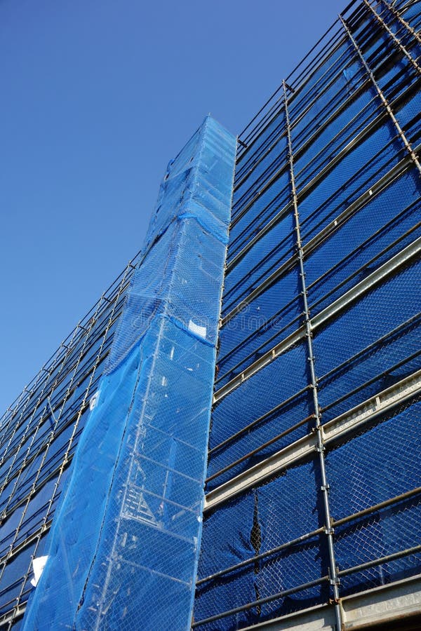 Scaffolding and Blue Safety Cladding on Construction Stock Photo ...