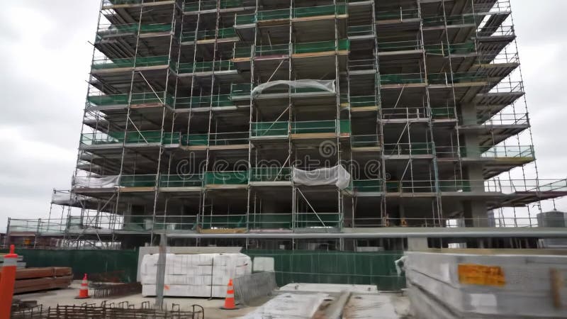 Construction Site with Scaffolding on Tall Building Stock Footage ...