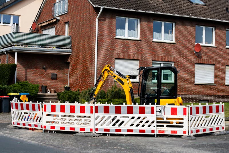 Construction Site with Small Excavator Near Residential Area Stock ...