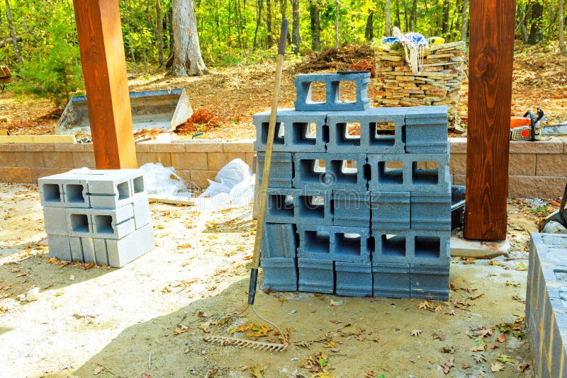 Construction Site with Stacked Concrete Blocks Under Wooden Structures ...
