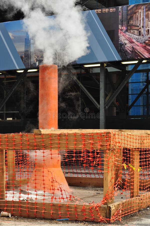 Construction Site on a Street with a Steam Spewing Pipe Stock Image ...