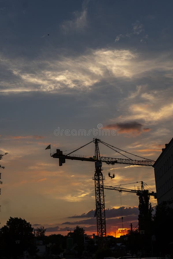 Construction Cranes at Sunset Stock Photo - Image of engineering ...