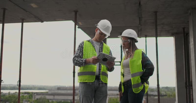 Construction Site Team or Architect and Builder or Worker with Helmets ...