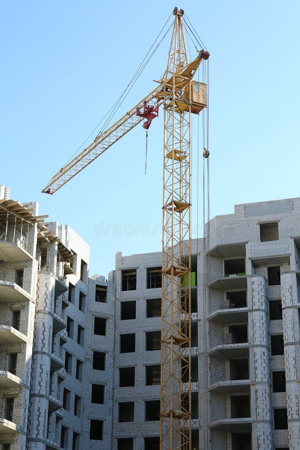 Construction Site with Tower Crane Near Unfinished Building Stock Photo ...