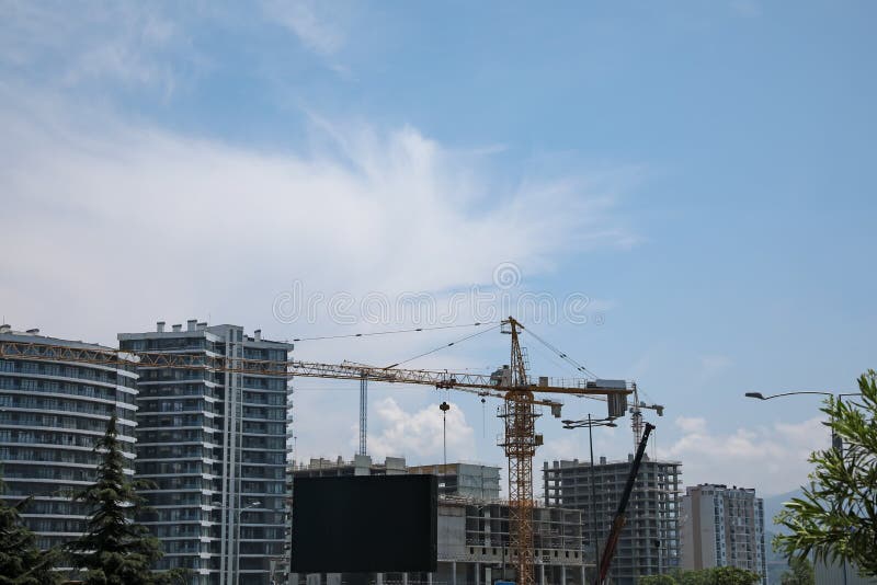 Construction Site with Tower Cranes Near Buildings Stock Image - Image ...