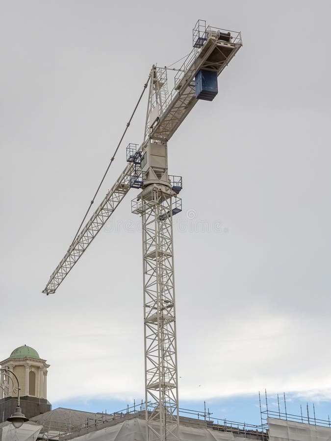 Construction Site in Town with Tall Crane. City Renovation and Upgrade ...
