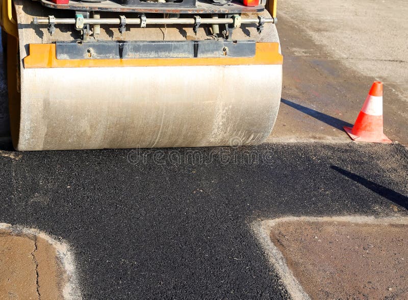 Construction Site with Traffic Cone and Asphalt Roller Stock Image ...