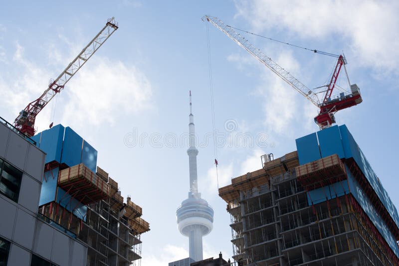 Toronto Construction Site with Two Cranes and CN Tower in the Middle ...