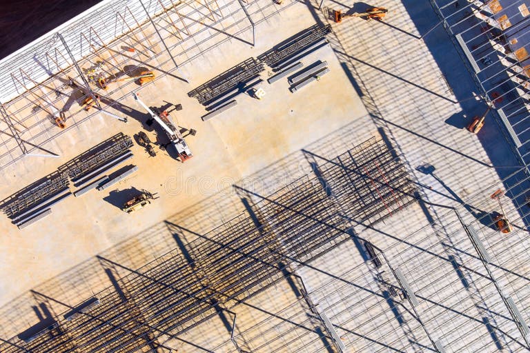 Construction Site Viewed from Above Featuring Beams, Tools, Workers in ...
