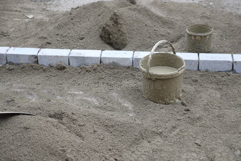 A Construction Site Where Sand and Buckets are Used To Prepare for ...