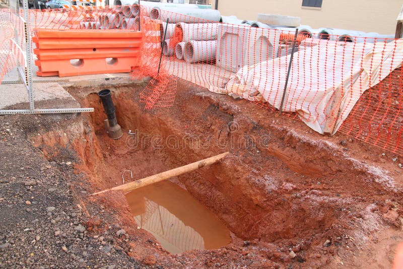 Construction Site during a Winter Thaw Stock Photo - Image of hole ...
