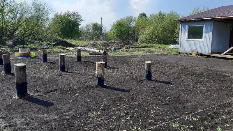 Construction Site with Wooden Posts for Foundation Work in Rural Area ...