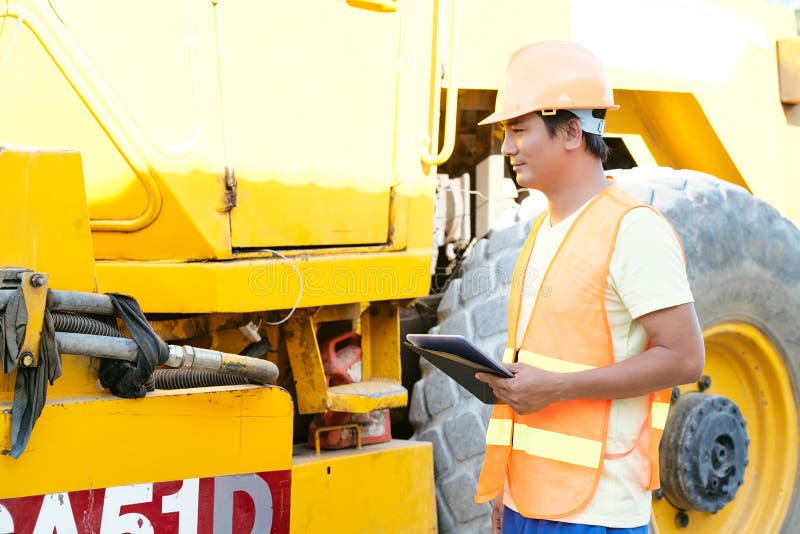 Construction Site Worker Checking Machines Stock Image - Image of ...
