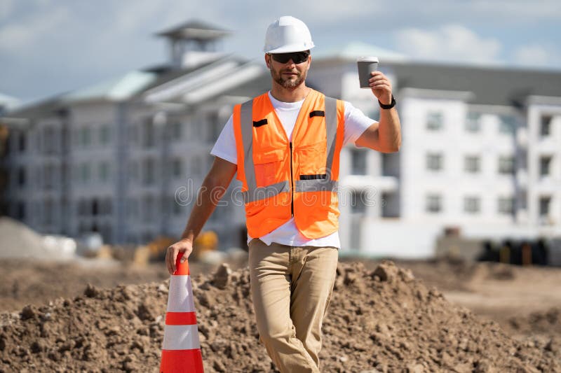 Construction Site Worker in Helmet Working Outdoor. a Builder in a ...
