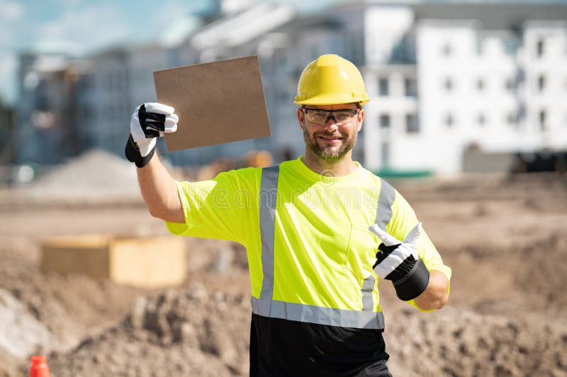 Construction Site Worker in Helmet Working Outdoor. a Builder in a ...